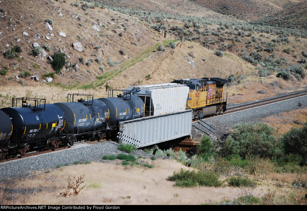 UP 5625 is DPU on west bound UP crossing Burnt River
